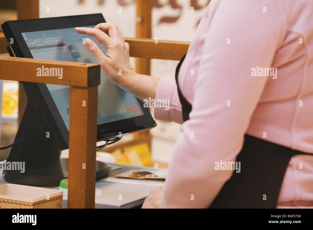 The cashier at the bakery Stock Photo - Alamy