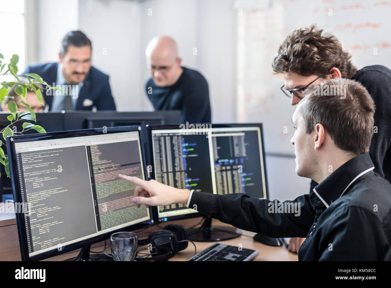 Startup business problem solving. Software developers working on ... Startup business problem solving. Software developers working on ...