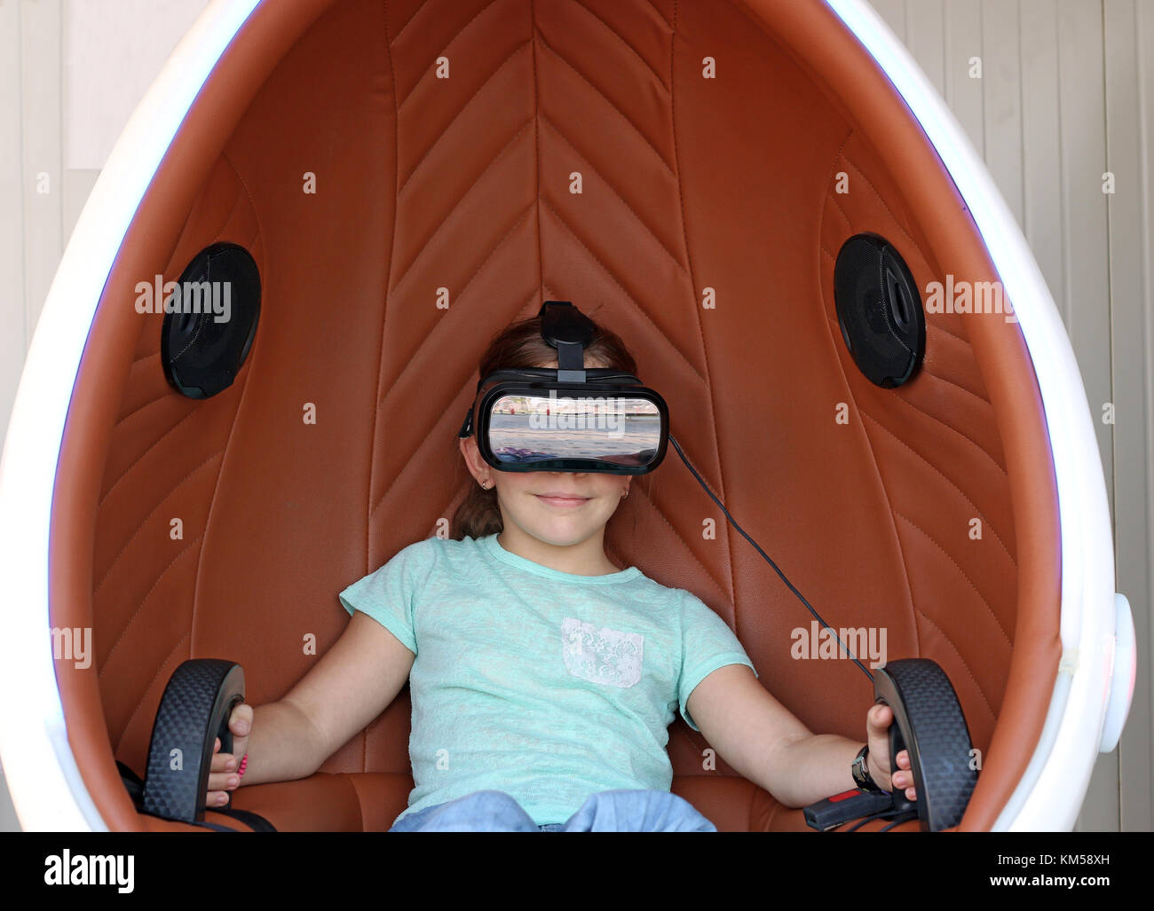 little girl with virtual reality headset play video game Stock Photo ...