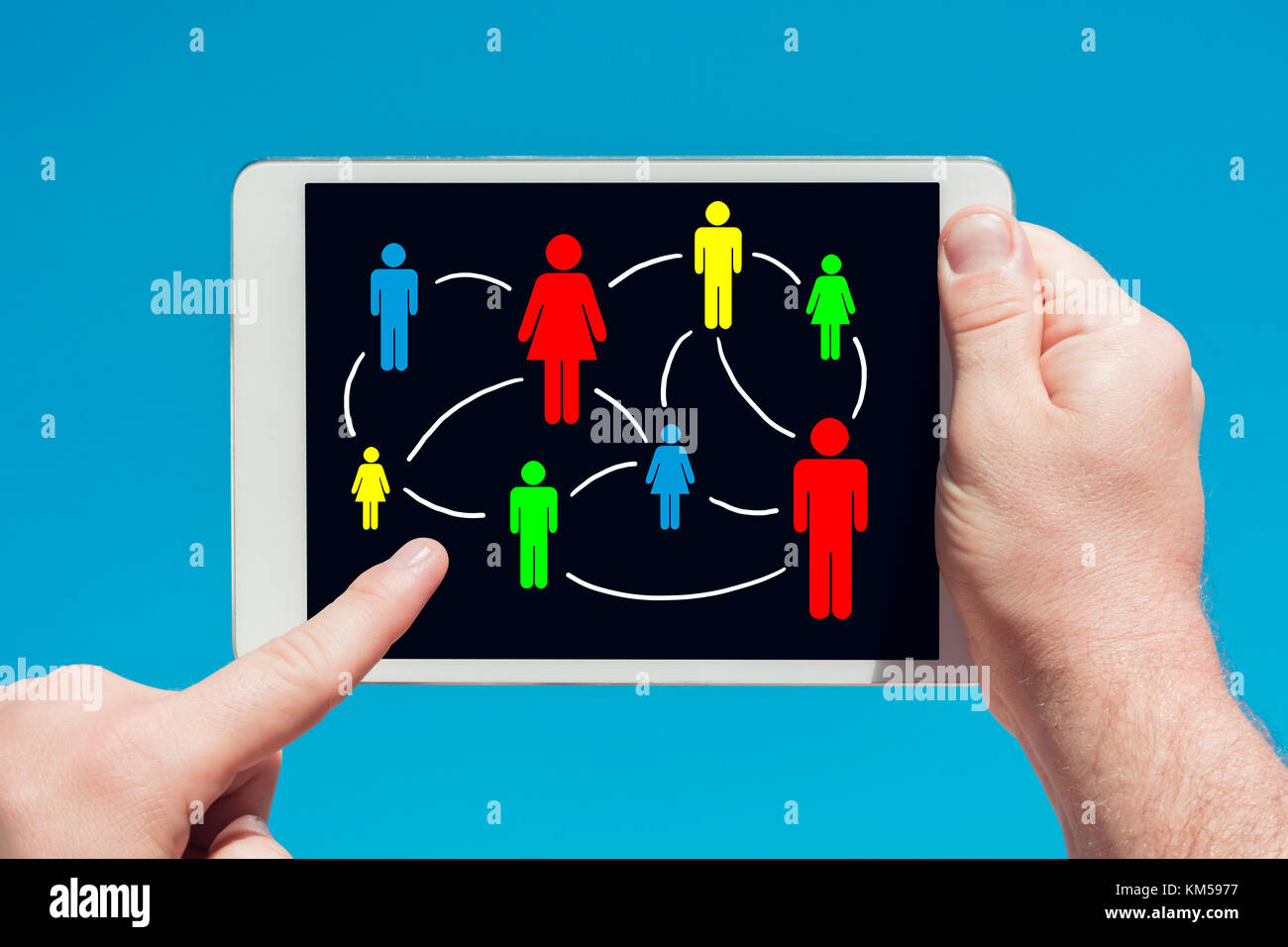 Man holding a tablet device showing social media and communications ...