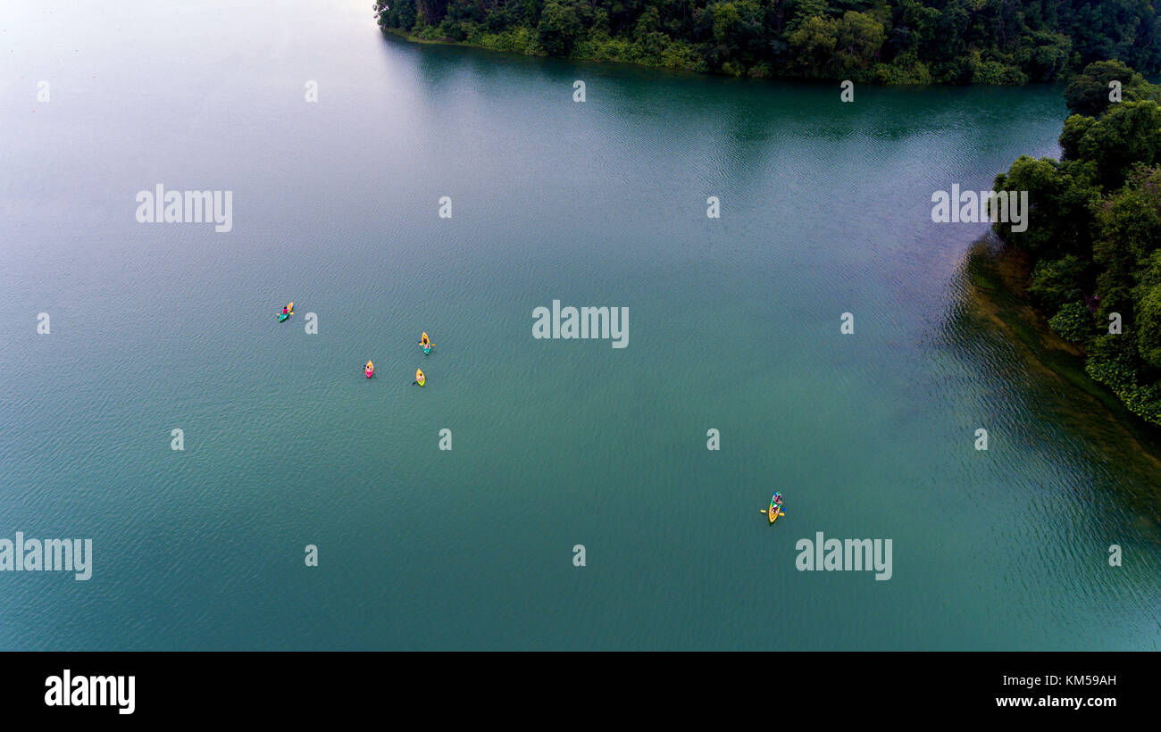 Kayaks on a gorgeous blue lake surrounded by greenery Stock Photo - Alamy