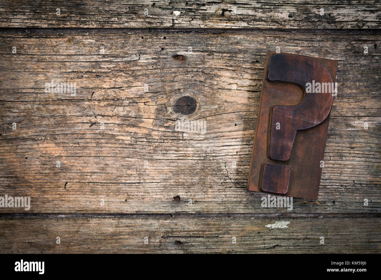 question mark vintage letterpress printing block on rustic wood ...