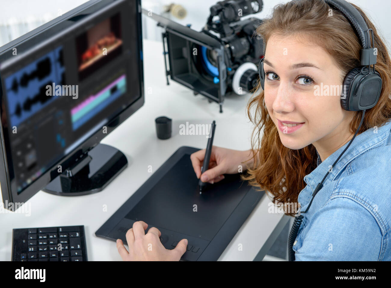 young woman designer using a graphics tablet for video editing Stock ...