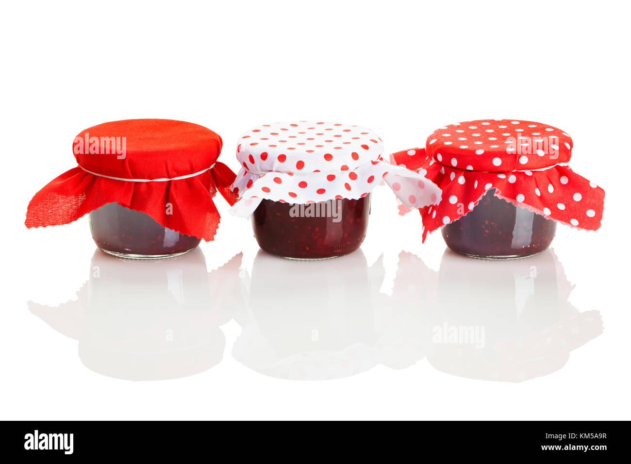 three jars with berry fruit jam isolated on white background Stock ...