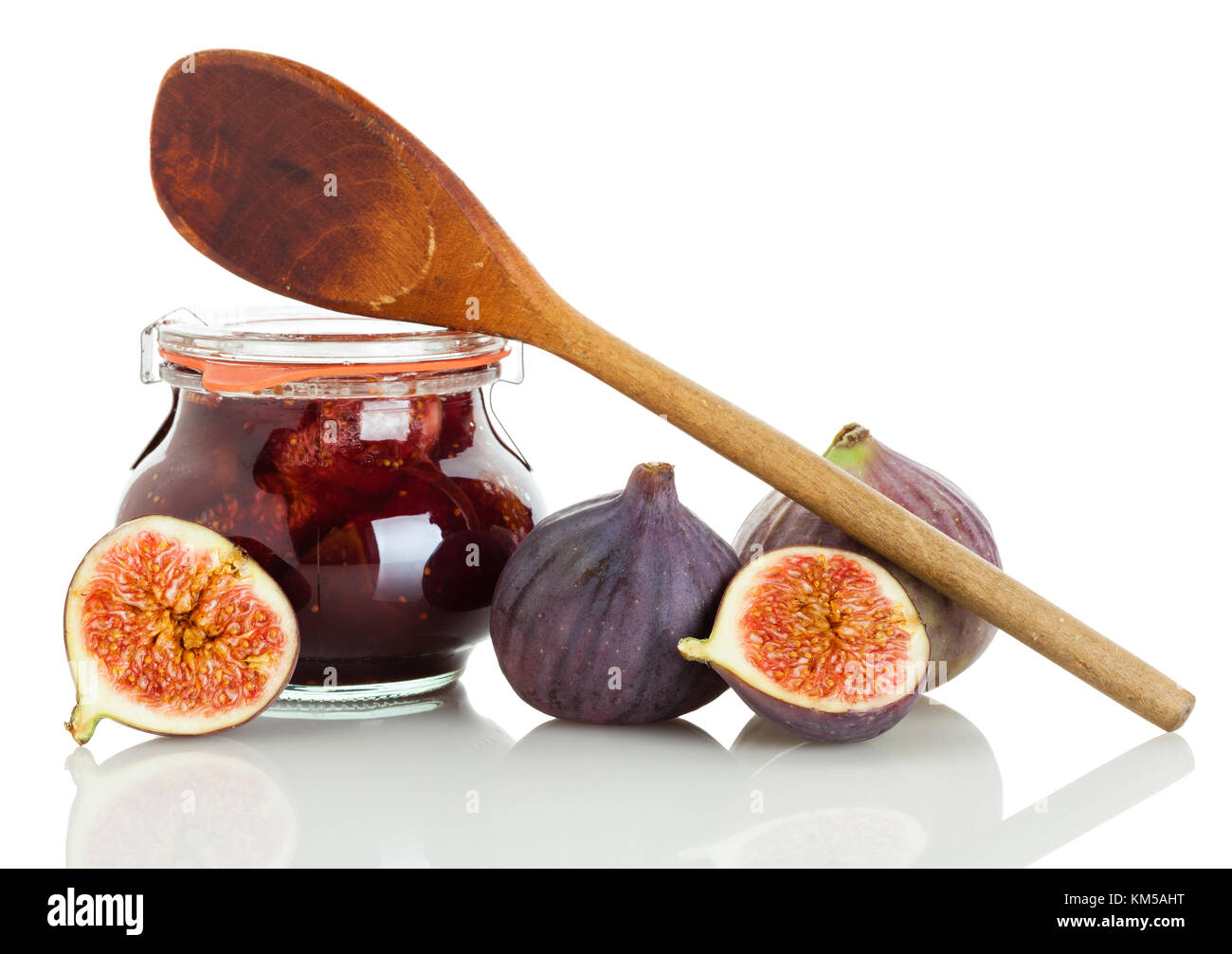 figs, jar of jam and cooking spoon isolated on white background Stock ...