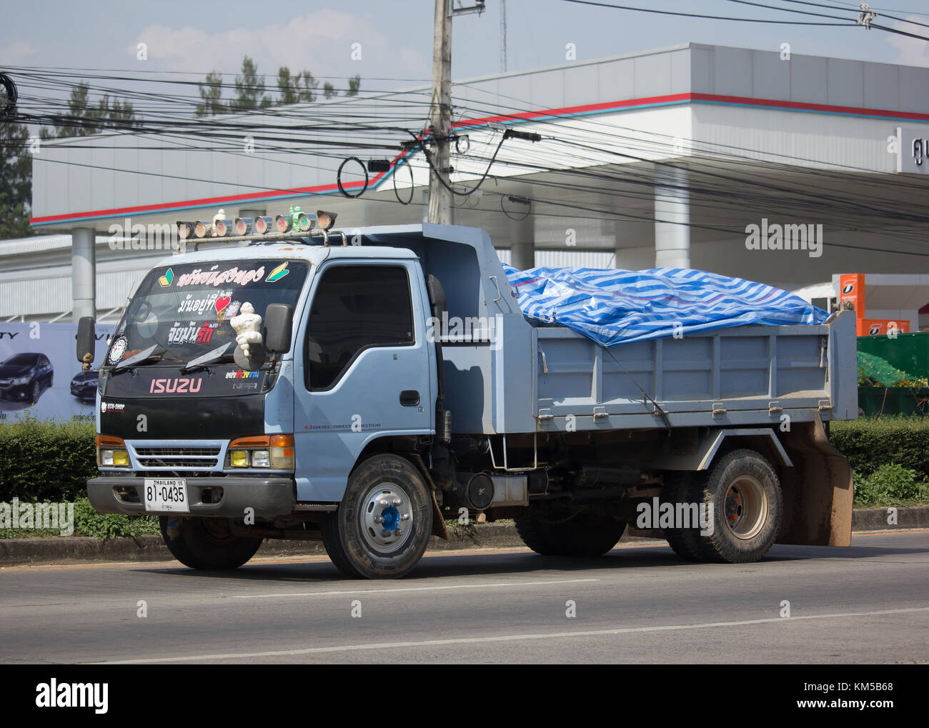 CHIANG MAI, THAILAND -NOVEMBER 21 2017: Private Isuzu Dump Truck. On road no.1001 8 km from ...