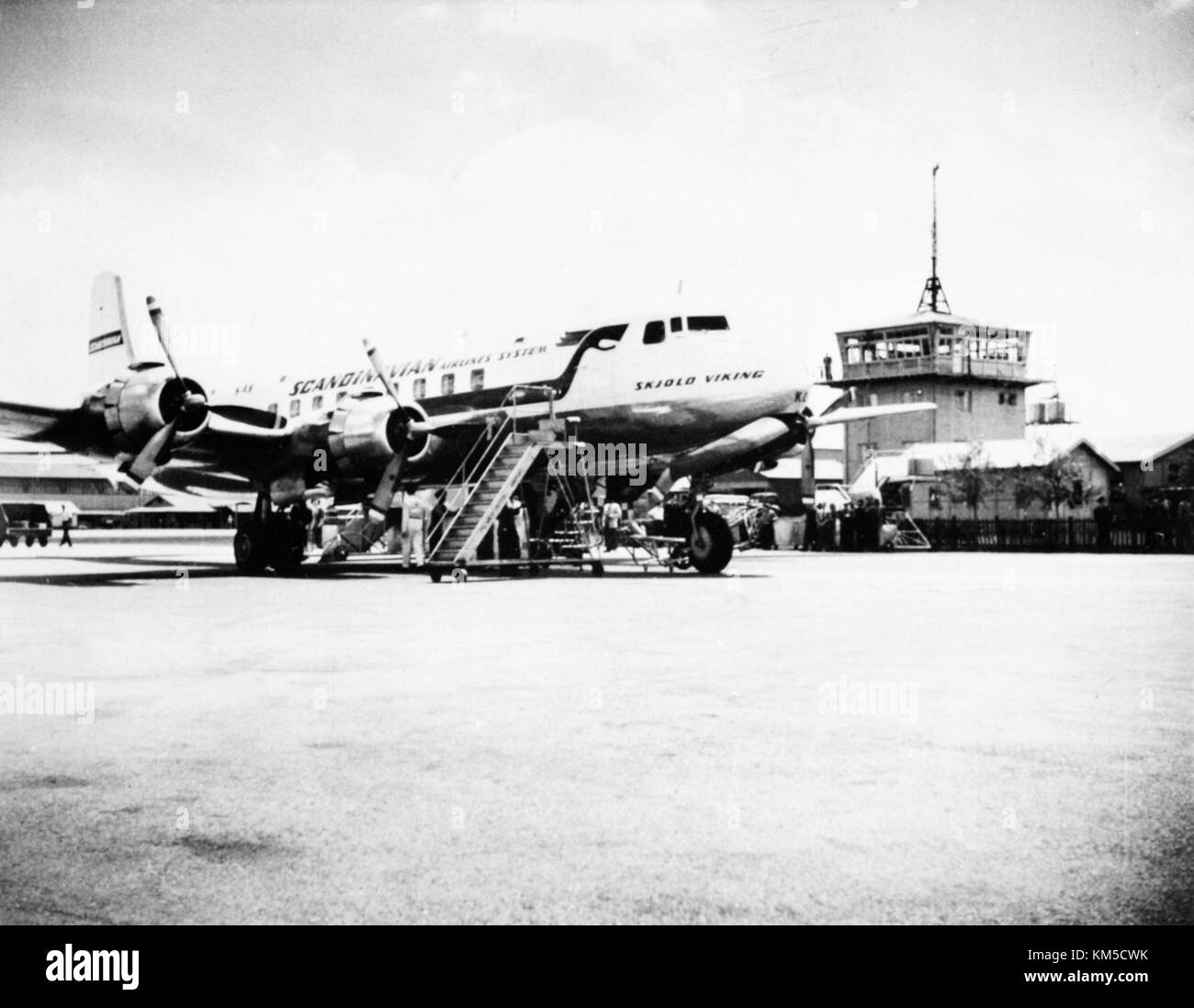 This image depicts the SAS DC-6 aircraft at Johannesburg Airport. The ...