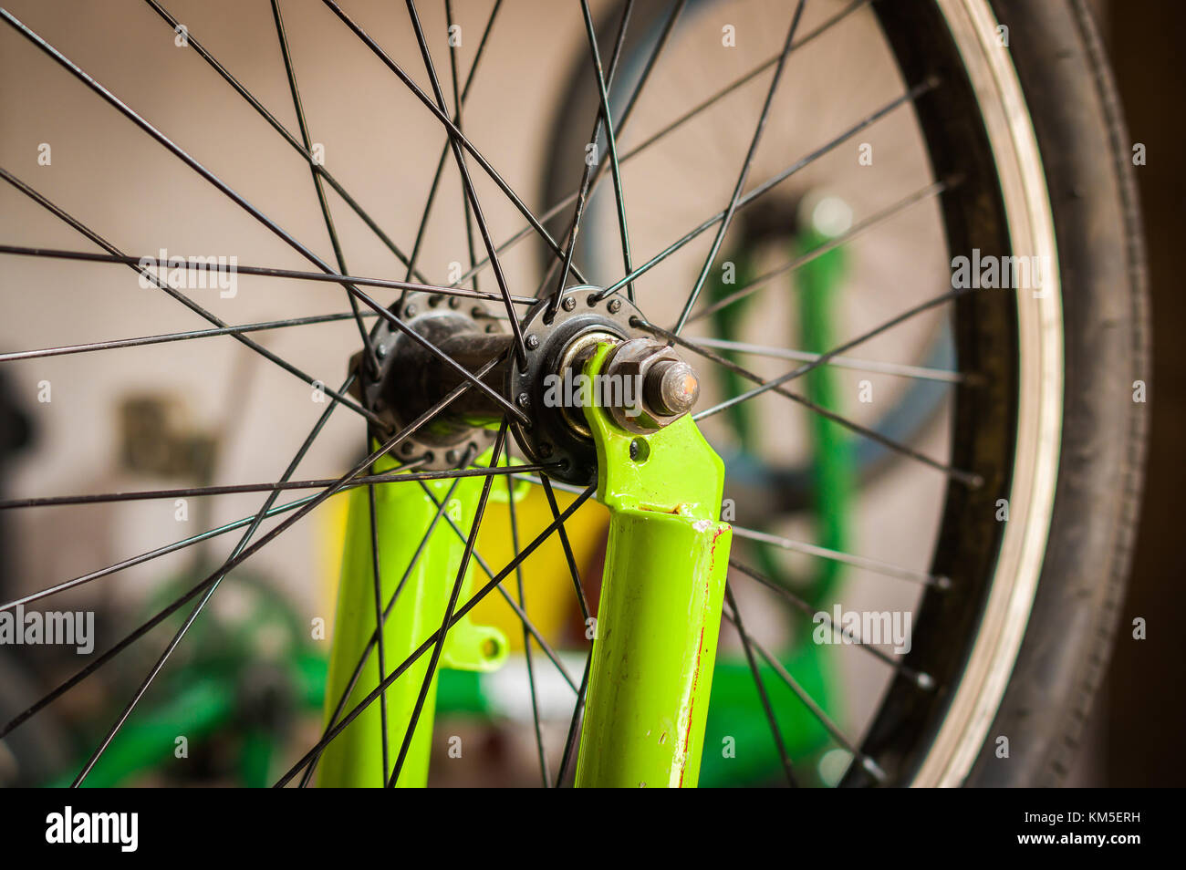 Close up of selective focus of the wheel of the bike in a workshop ...