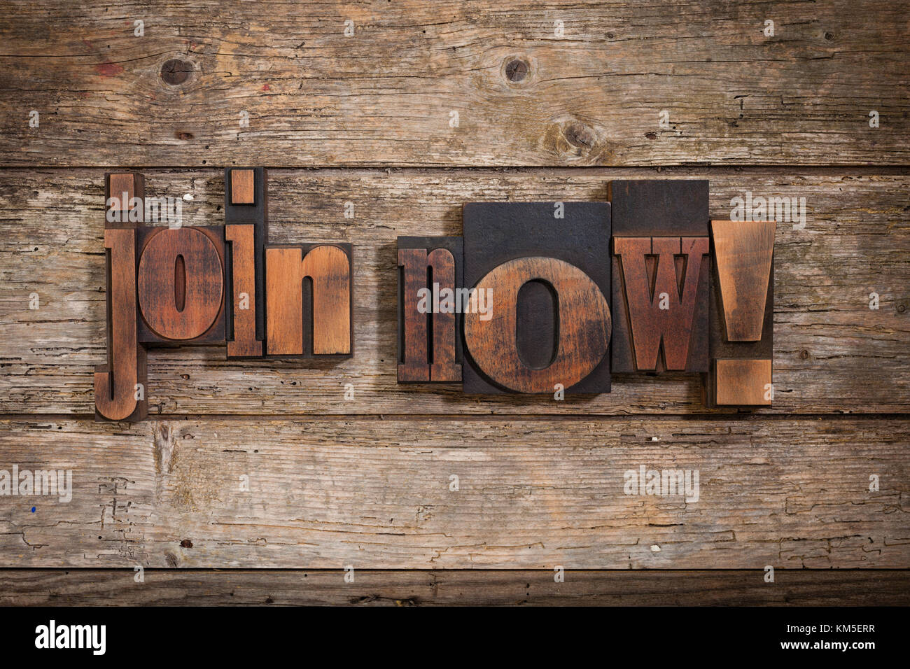 Join now, phrase set with vintage letterpress printing blocks on rustic ...