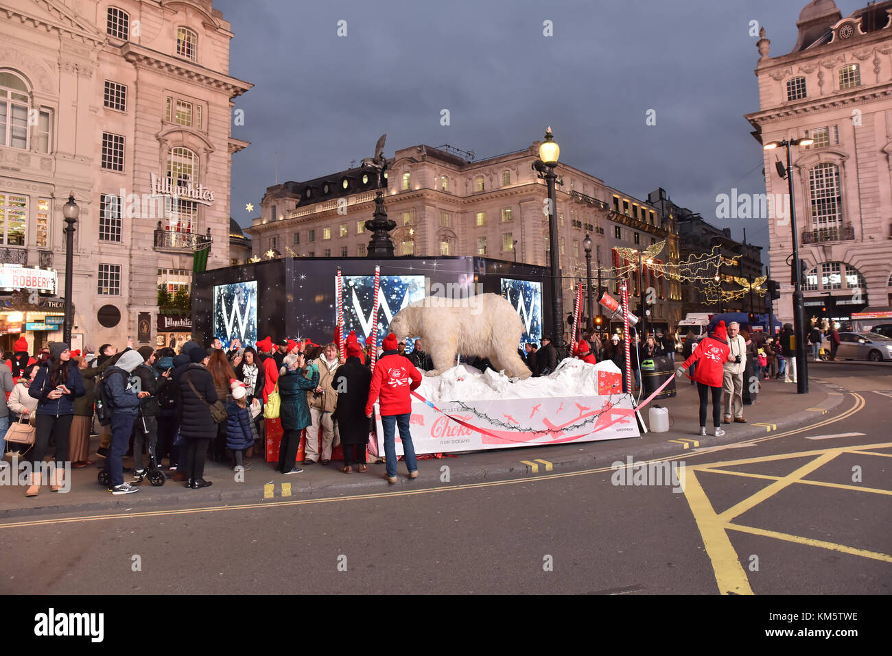 Piccadilly Circus, London, UK. 5th Dec, 2017. Greenpeace spoof a Coca ...
