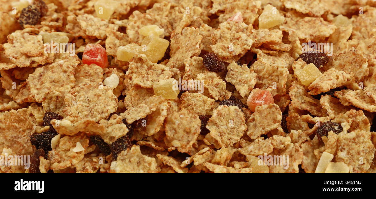 Breakfast granola muesli with dried fruits close up pattern background ...