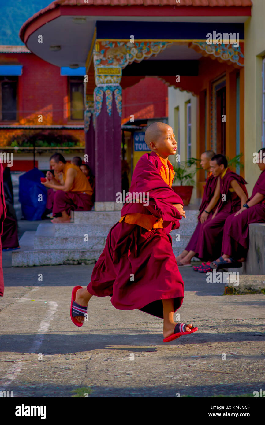 POKHARA, NEPAL - OCTOBER 06 2017: Unidentified Buddhist monk boy ...