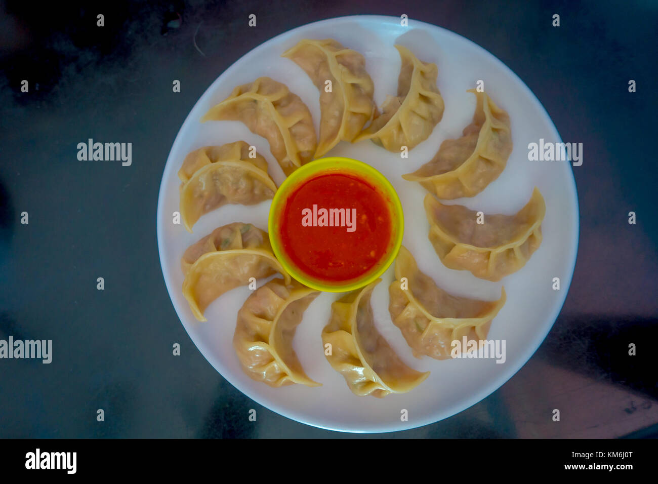 Top view of delicious Nepali traditional snack, chicken MoMo serve with ...