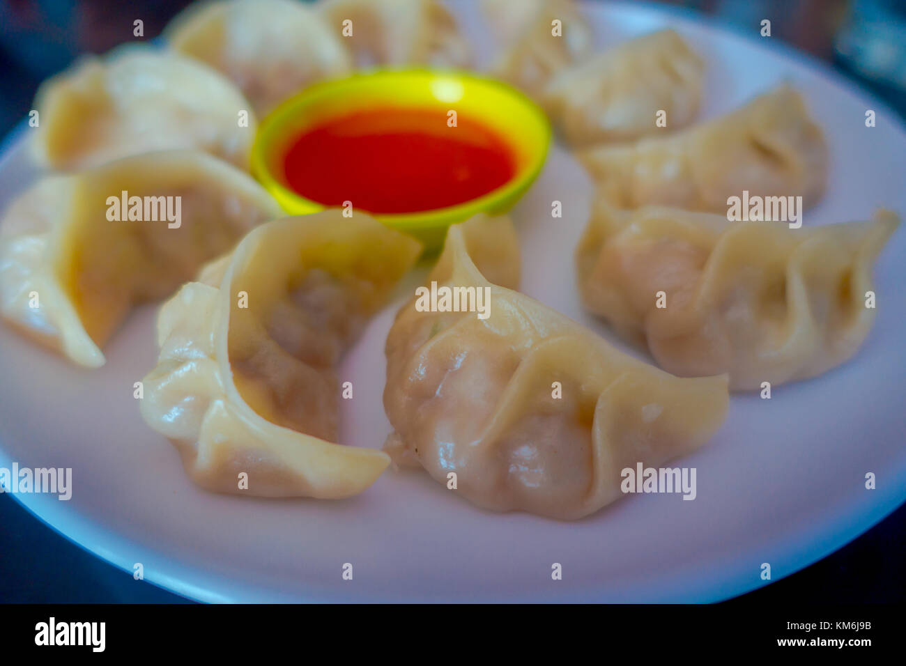 Delicious Nepali traditional snack, chicken MoMo serve with spicy and ...