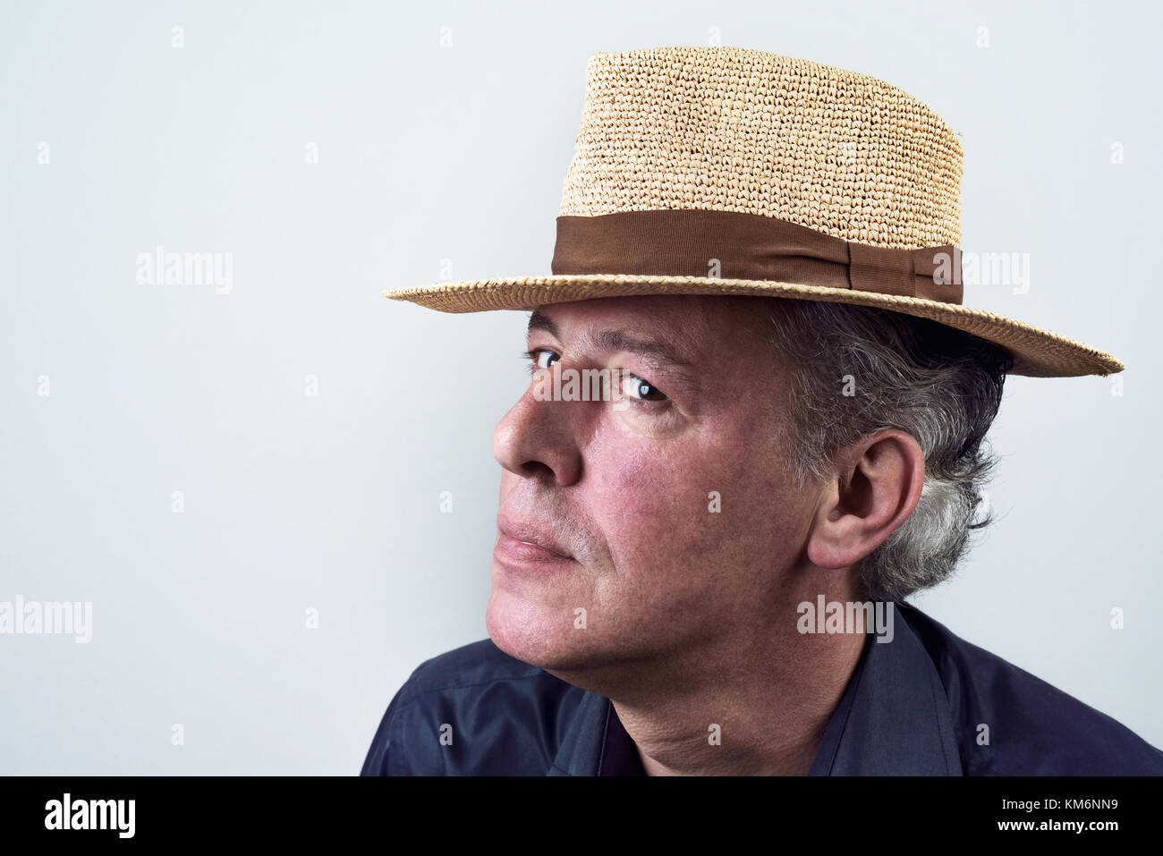Senior caucasian man in straw hat and black shirt Stock Photo - Alamy