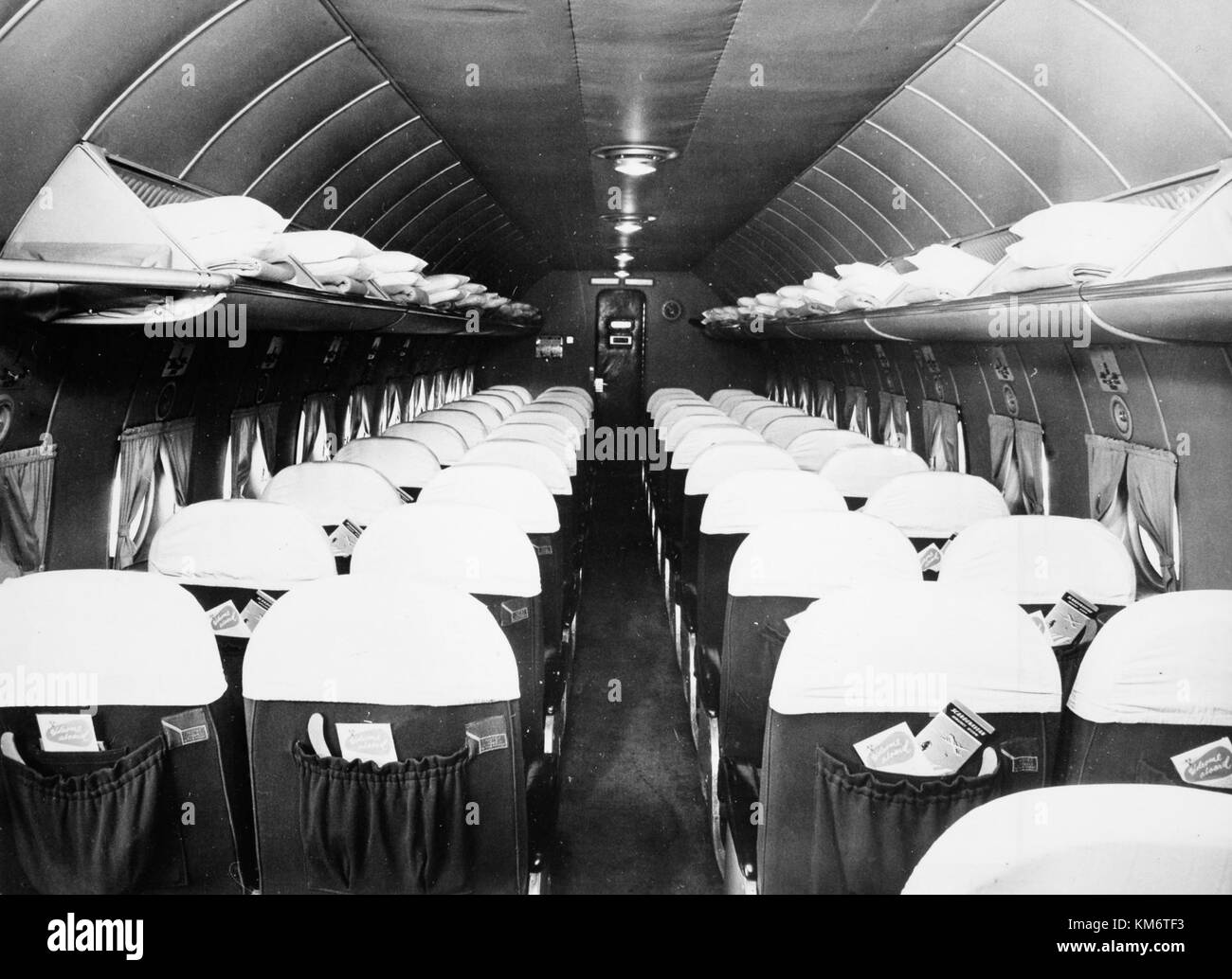 The interior cabin of the SAS DC-4, a vintage aircraft, offers a ...