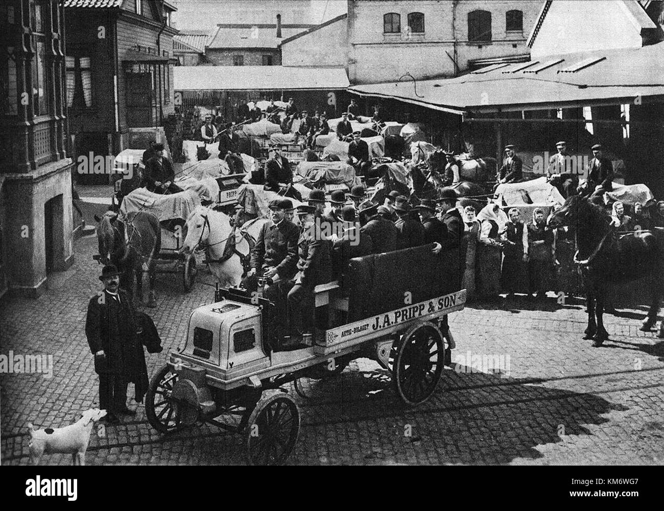 This image shows a historical 1898 truck, a significant early example ...