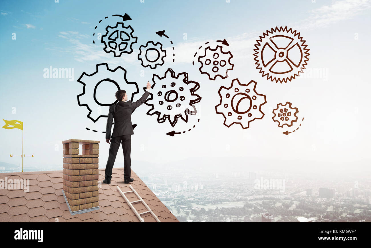 Mister boss on brick roof standing with back and draw teamwork concept ...