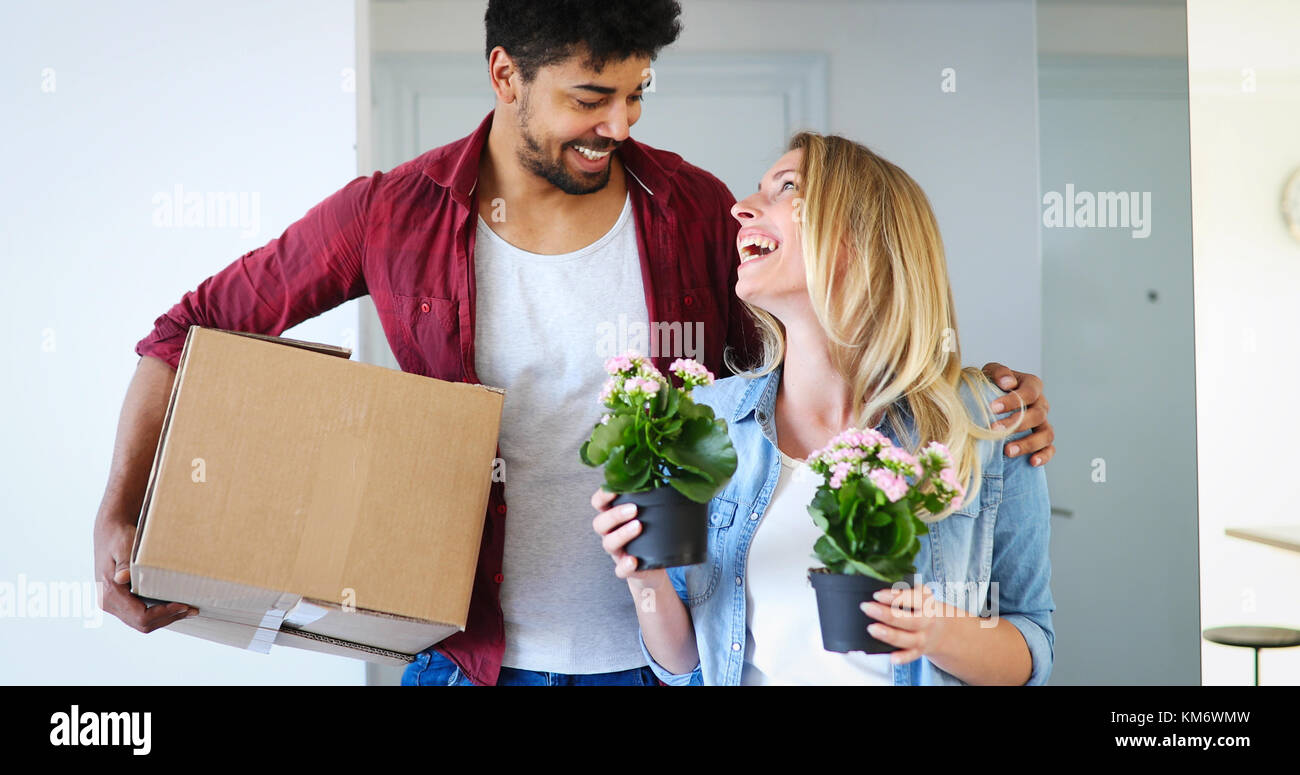 home, people, moving and real estate concept - happy couple having fun ...