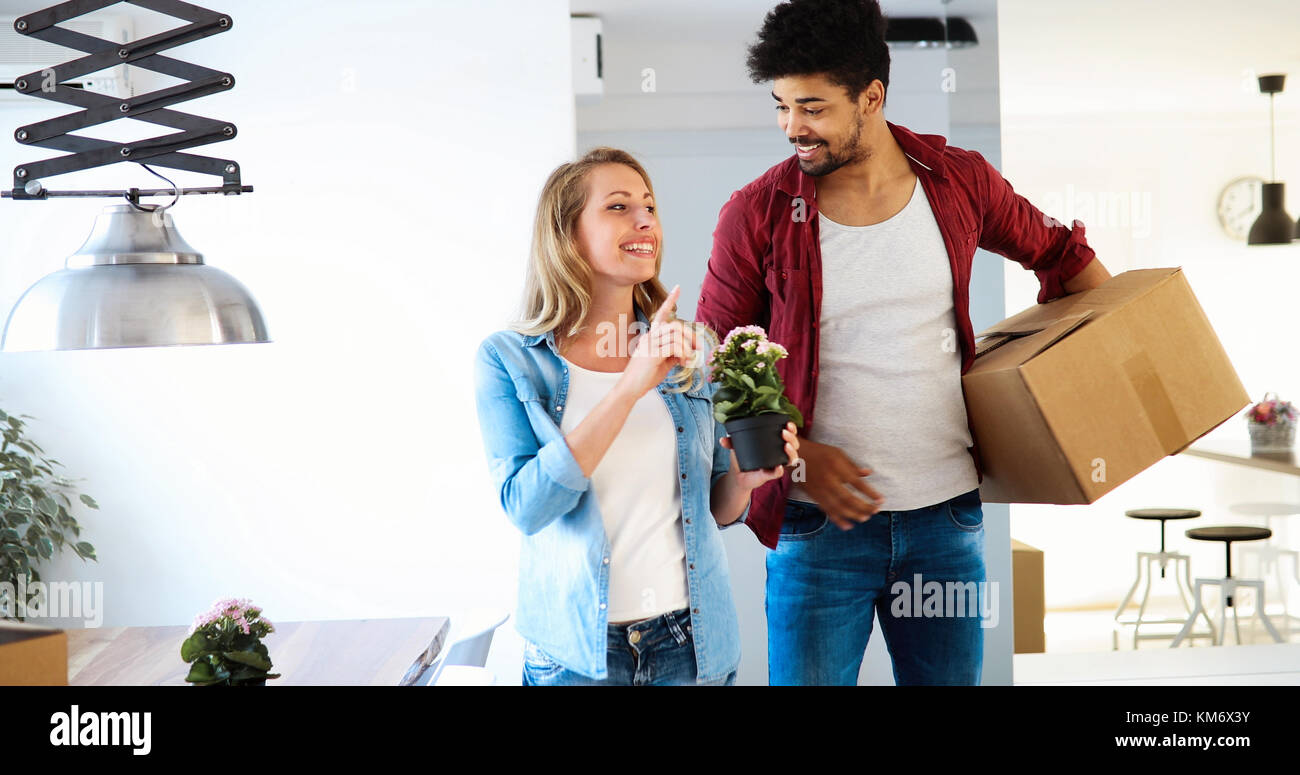 Happy couple after moving in Stock Photo - Alamy