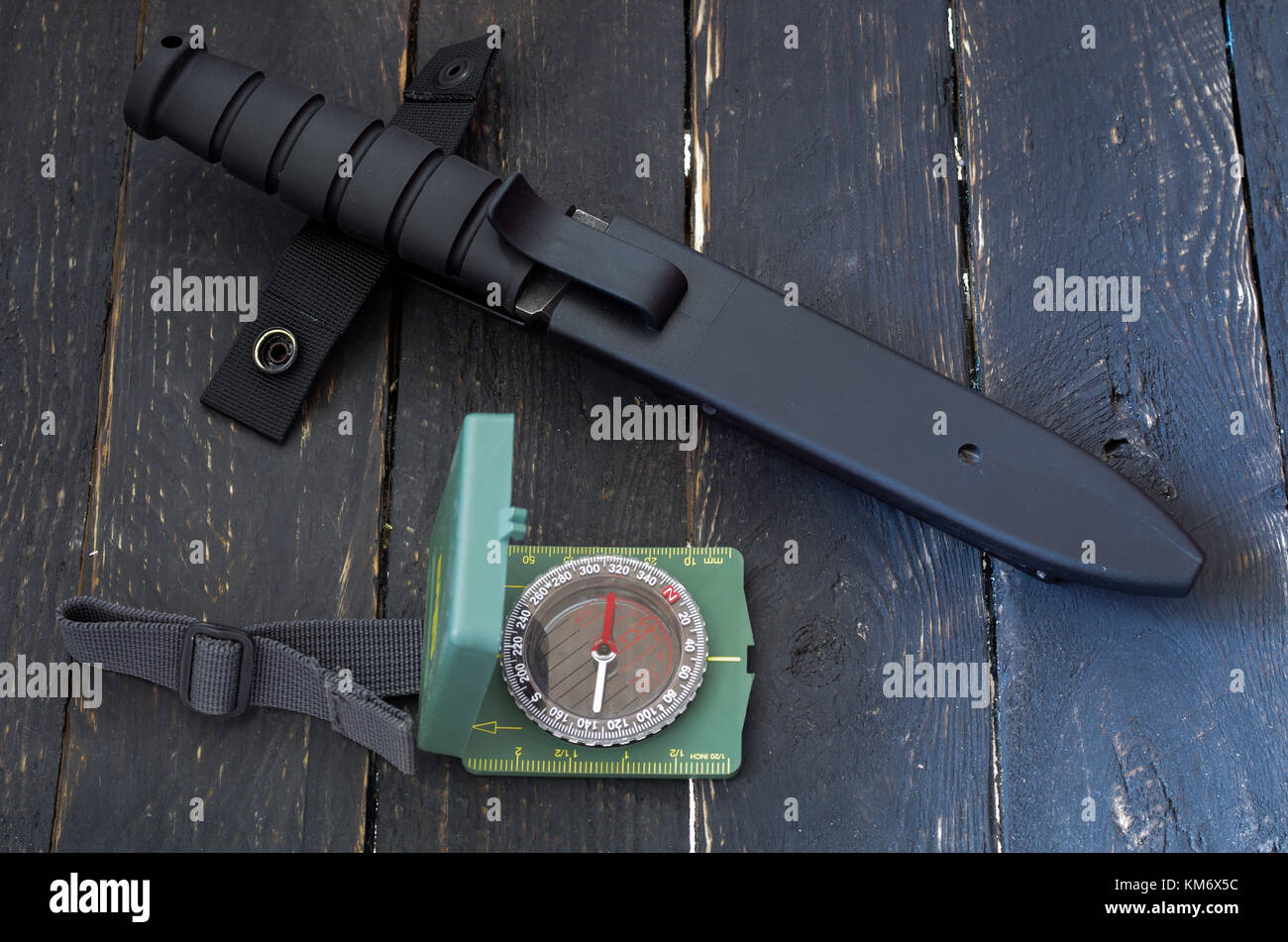 Military knife in plastic sheath. Compass for orientation Stock Photo ...