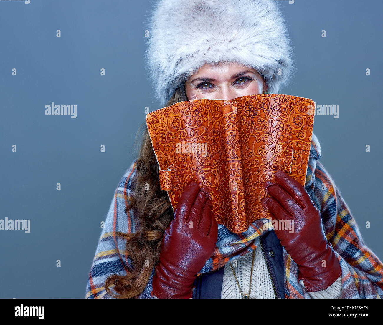 Woman hiding book holiday hi-res stock photography and images - Alamy