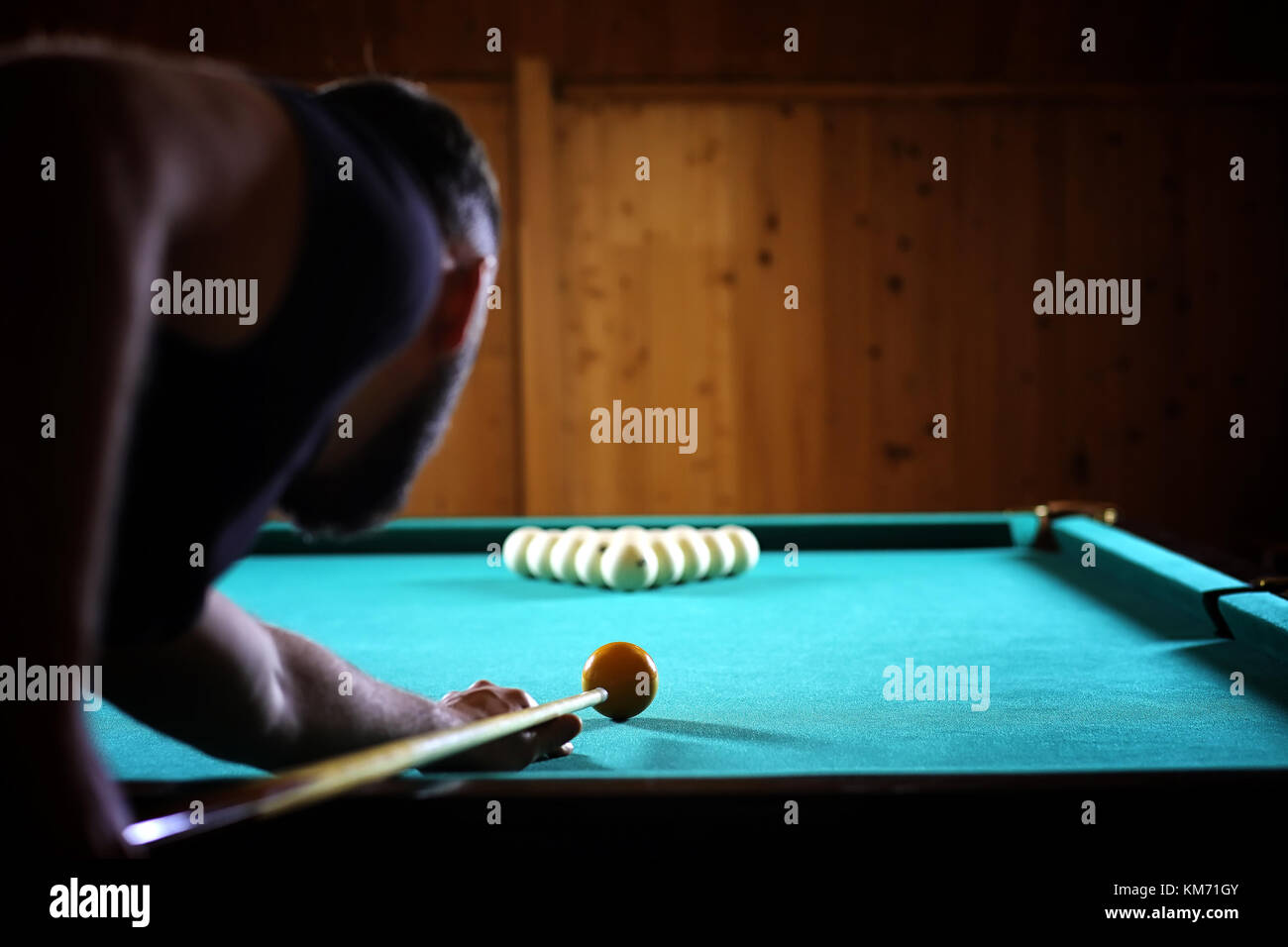 A man with a beard plays a big billiard. Party in a 12-foot pool Stock ...