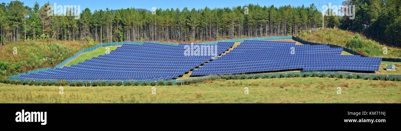 Photovoltaic panels in a field panorama Stock Photo - Alamy