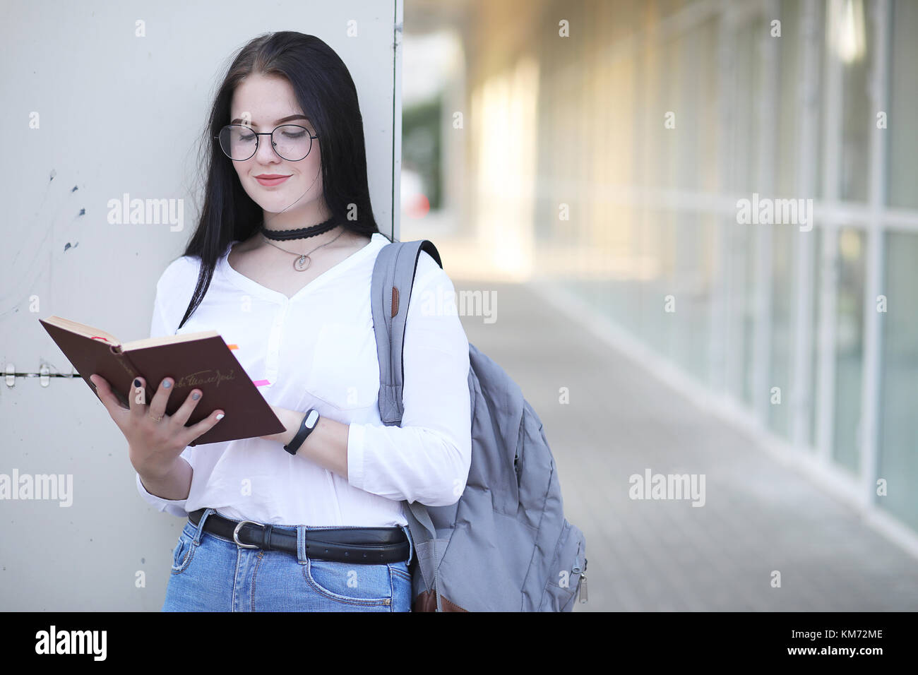 Girl student on the street with books Stock Photo - Alamy