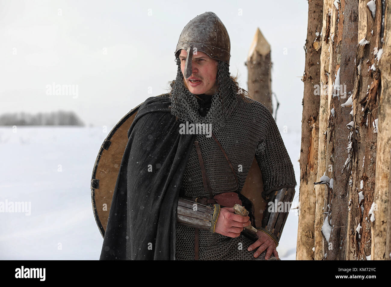 Defender the young warrior in mail armor Stock Photo - Alamy