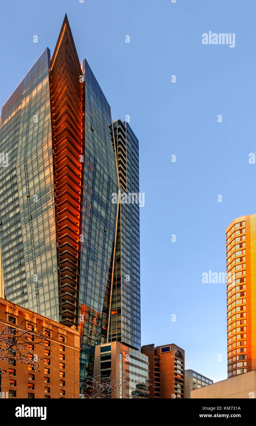 A bottom-up and from the front view on to modern skyscrapers, houses ...