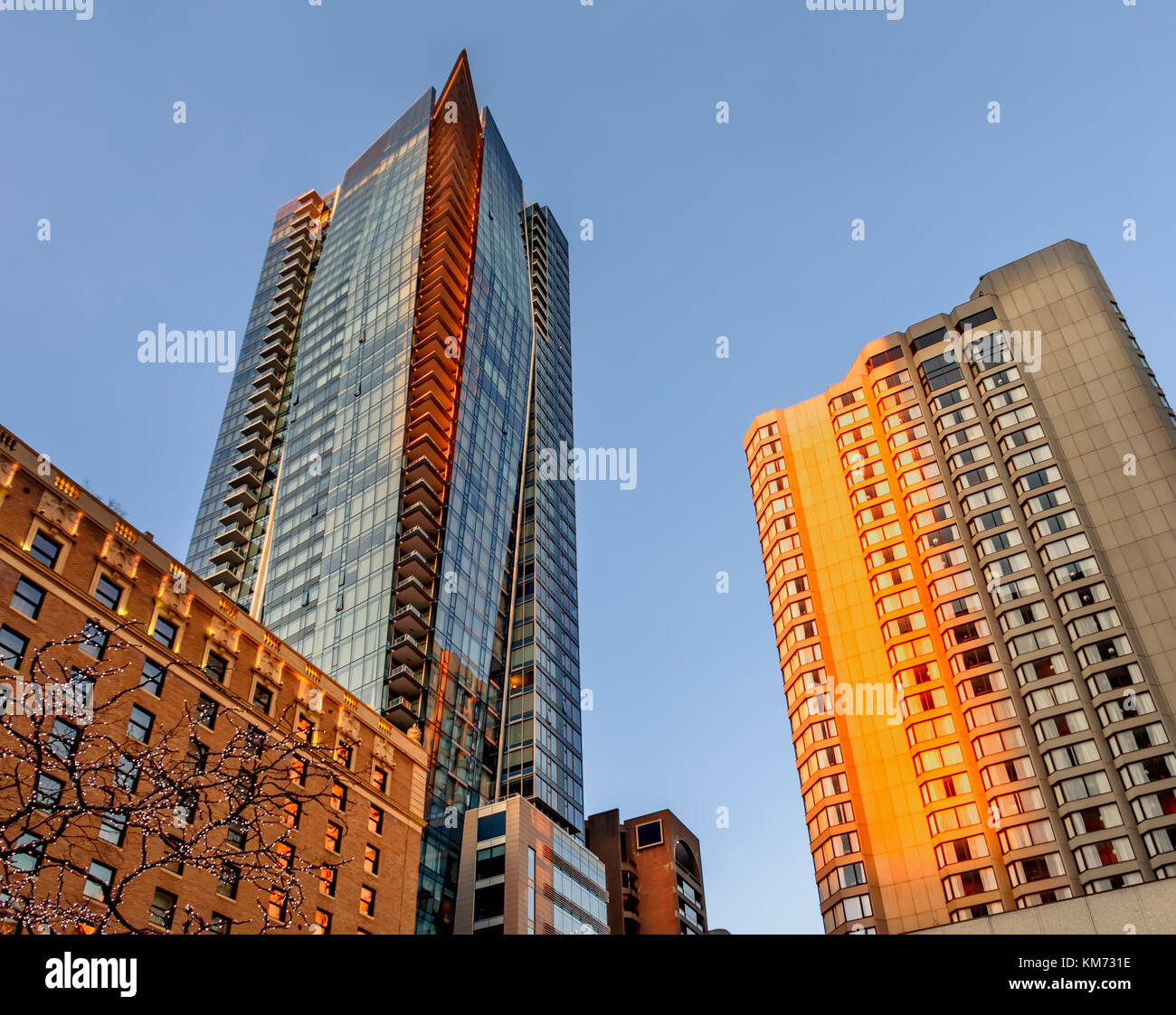 A bottom-up and from the front view on to modern skyscrapers, houses ...