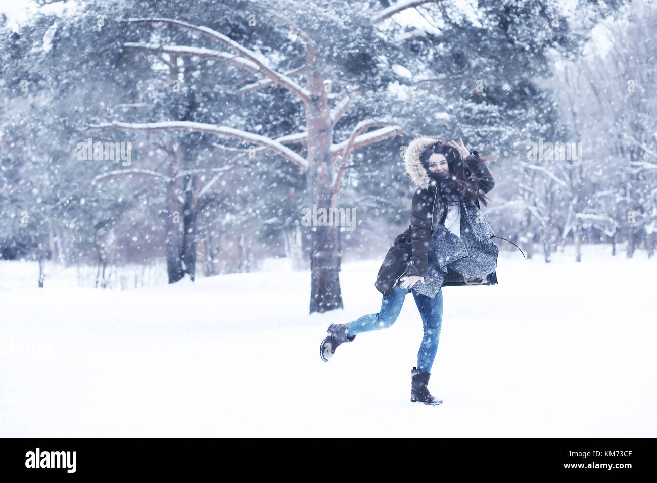 Beautiful girl in a beautiful winter snow Stock Photo - Alamy