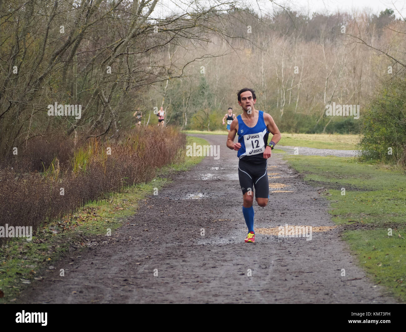 A male runner taking part in a trail running race Stock Photo - Alamy