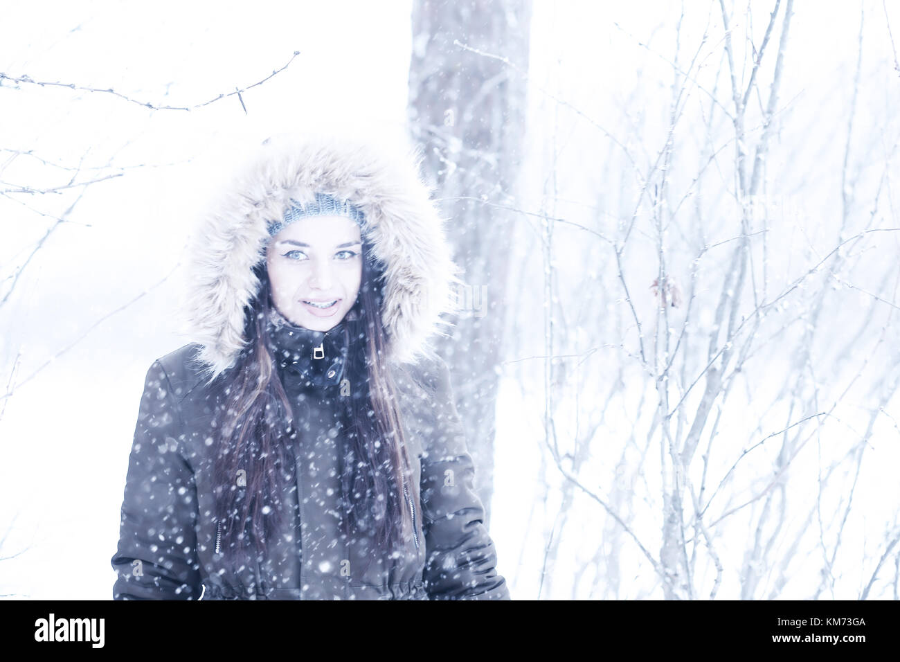 Beautiful girl in a beautiful winter snow Stock Photo - Alamy