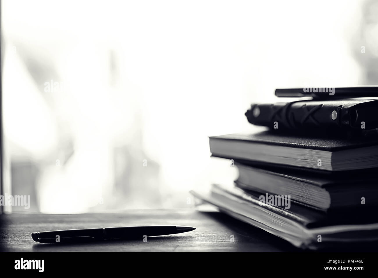 A stack of textbooks on a table Stock Photo - Alamy