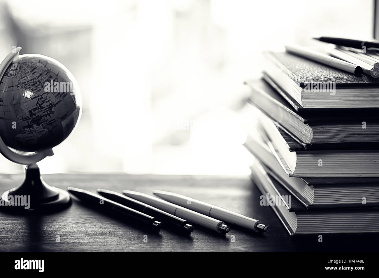 A stack of textbooks on a table Stock Photo - Alamy
