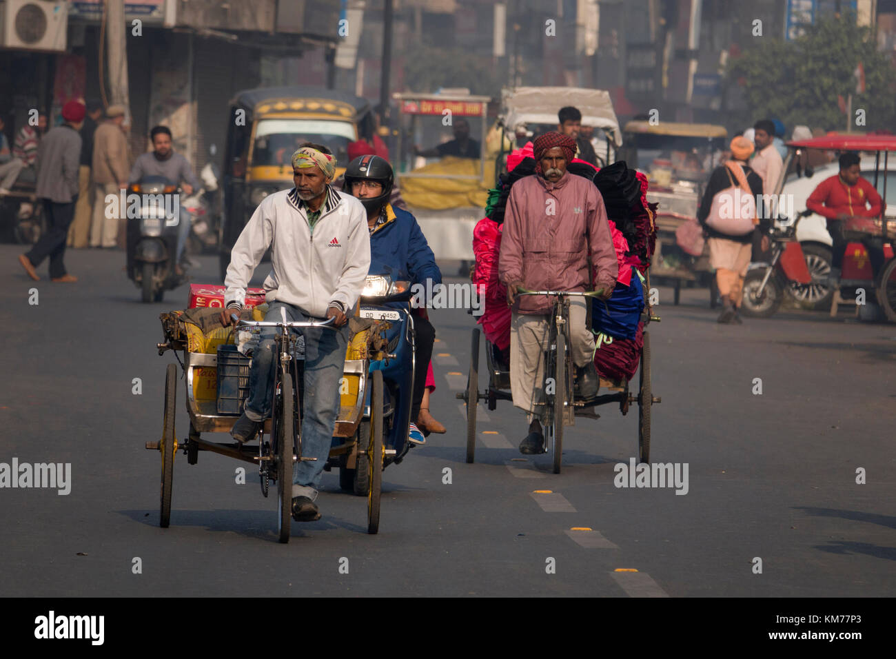 Punjabi Sikh men pedaling cycle rickshaw in Amritsar, India Stock Photo ...