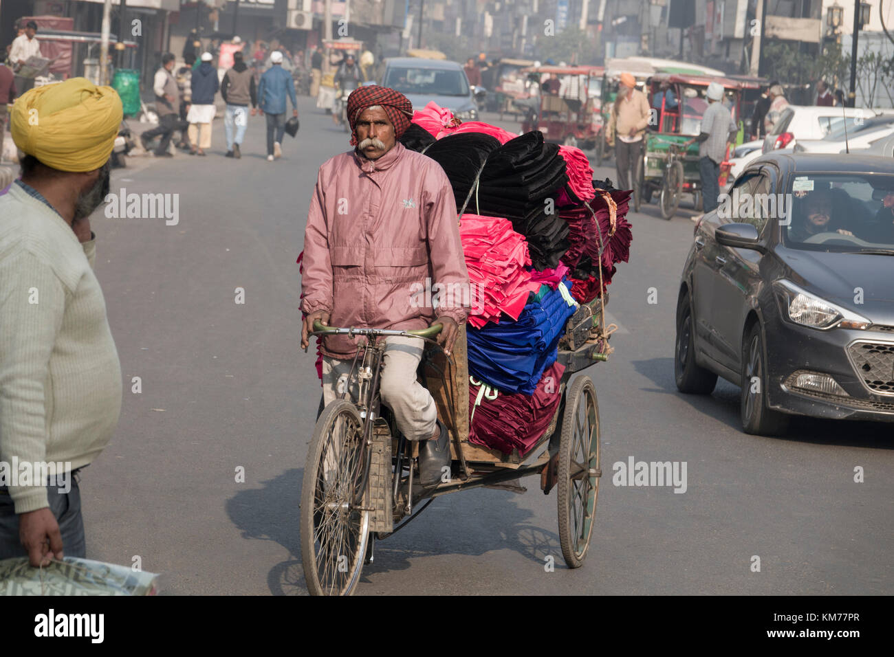 Punjabi Sikh man pedaling cycle rickshaw in Amritsar, India Stock Photo ...