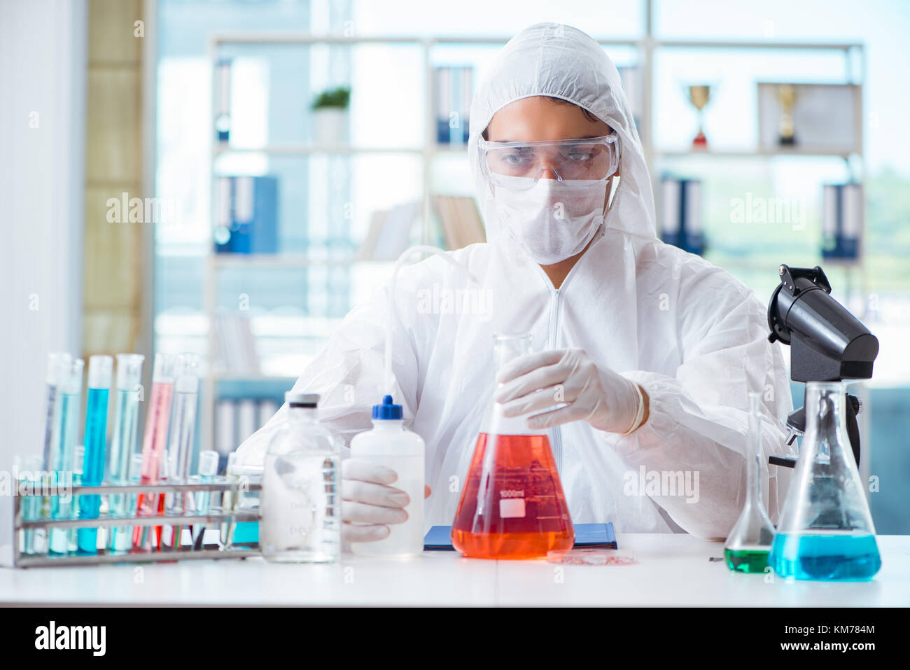 Chemist working in the laboratory with hazardous chemicals Stock Photo ...