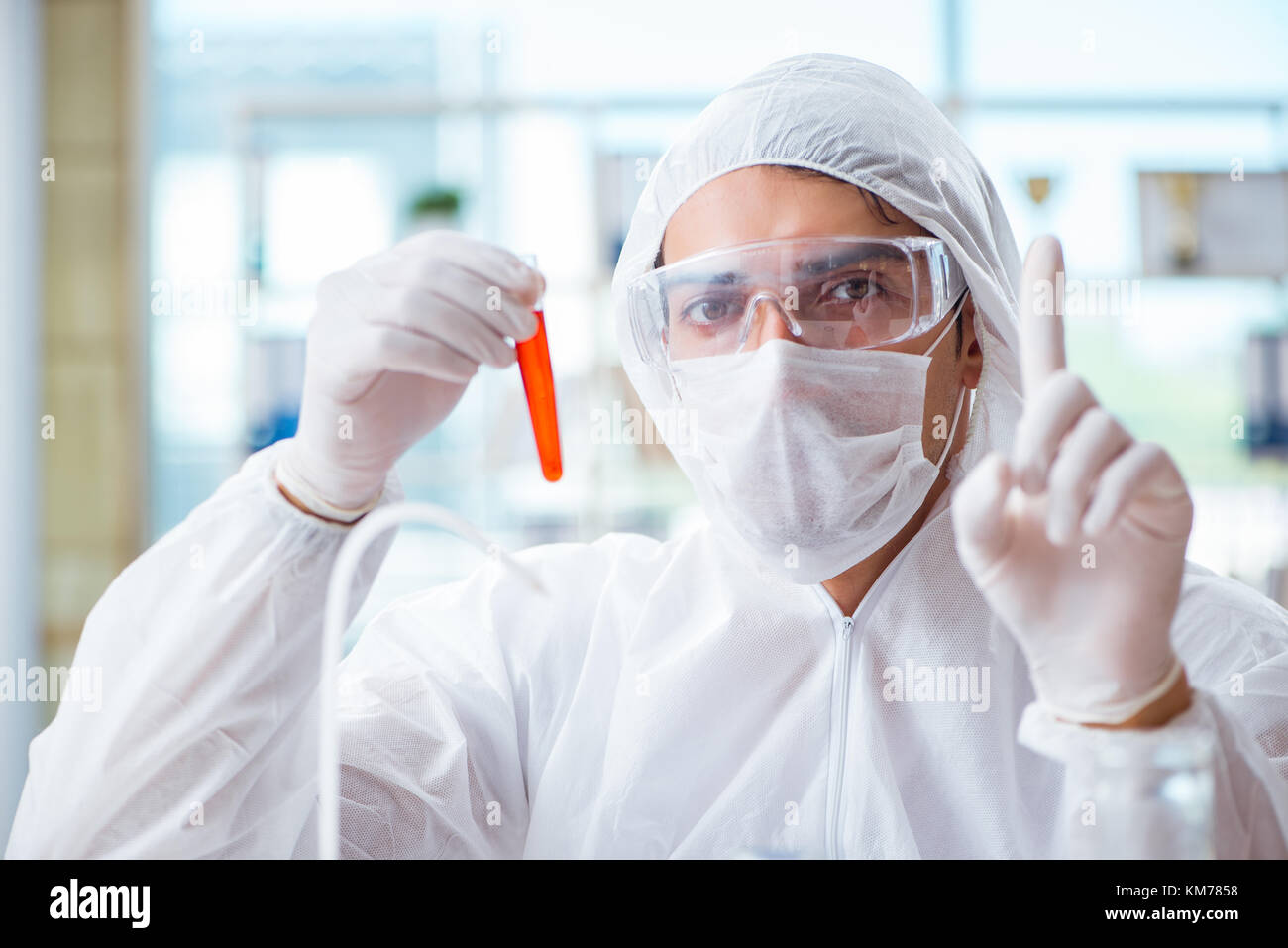 Chemist working in the laboratory with hazardous chemicals Stock Photo ...