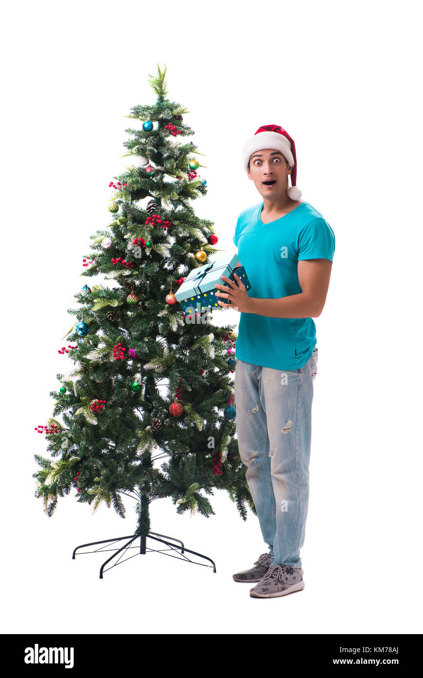 Young man decorating christmas tree isolated on white Stock Photo - Alamy