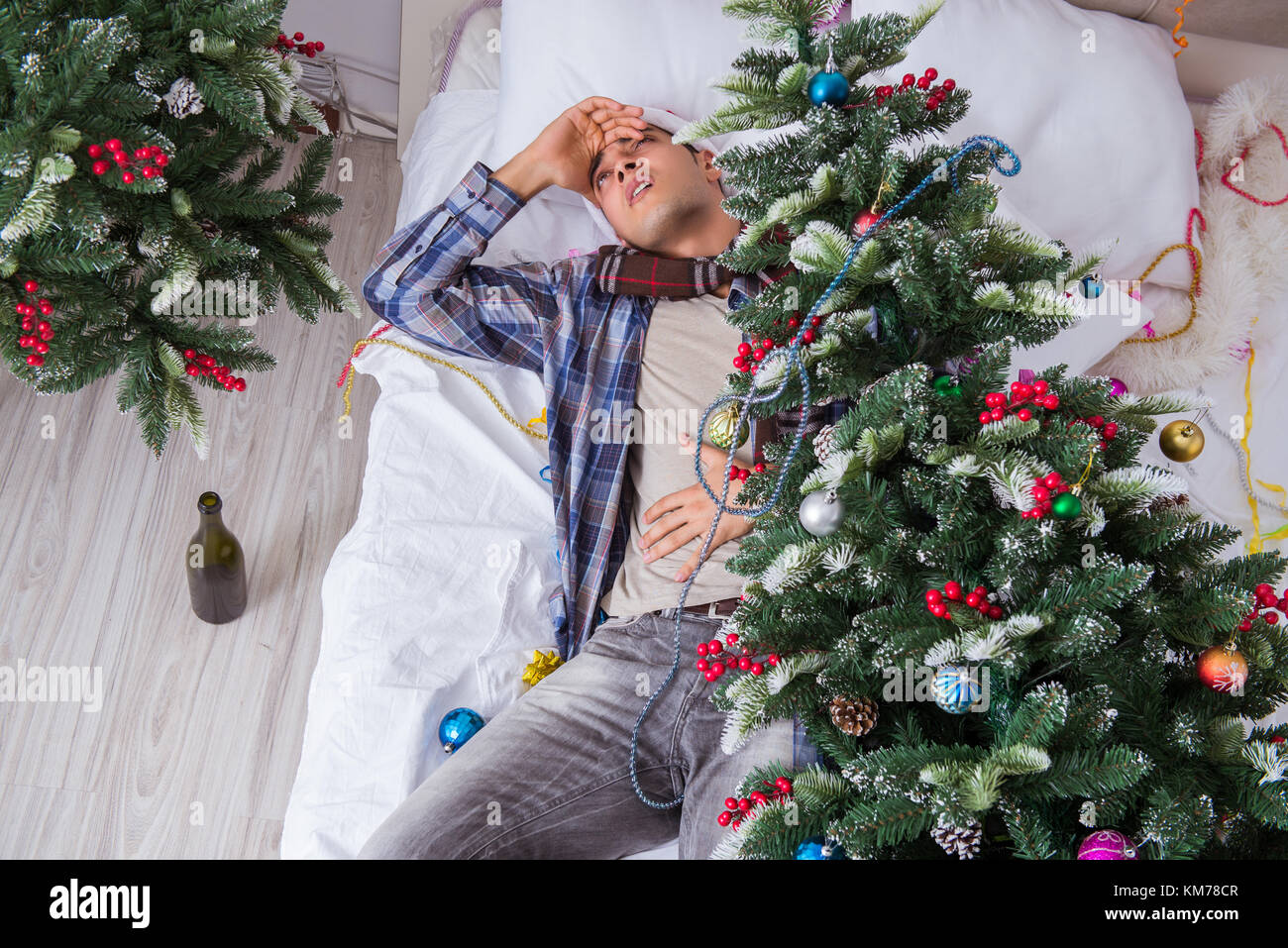 Man suffering hangover after christmas party Stock Photo - Alamy