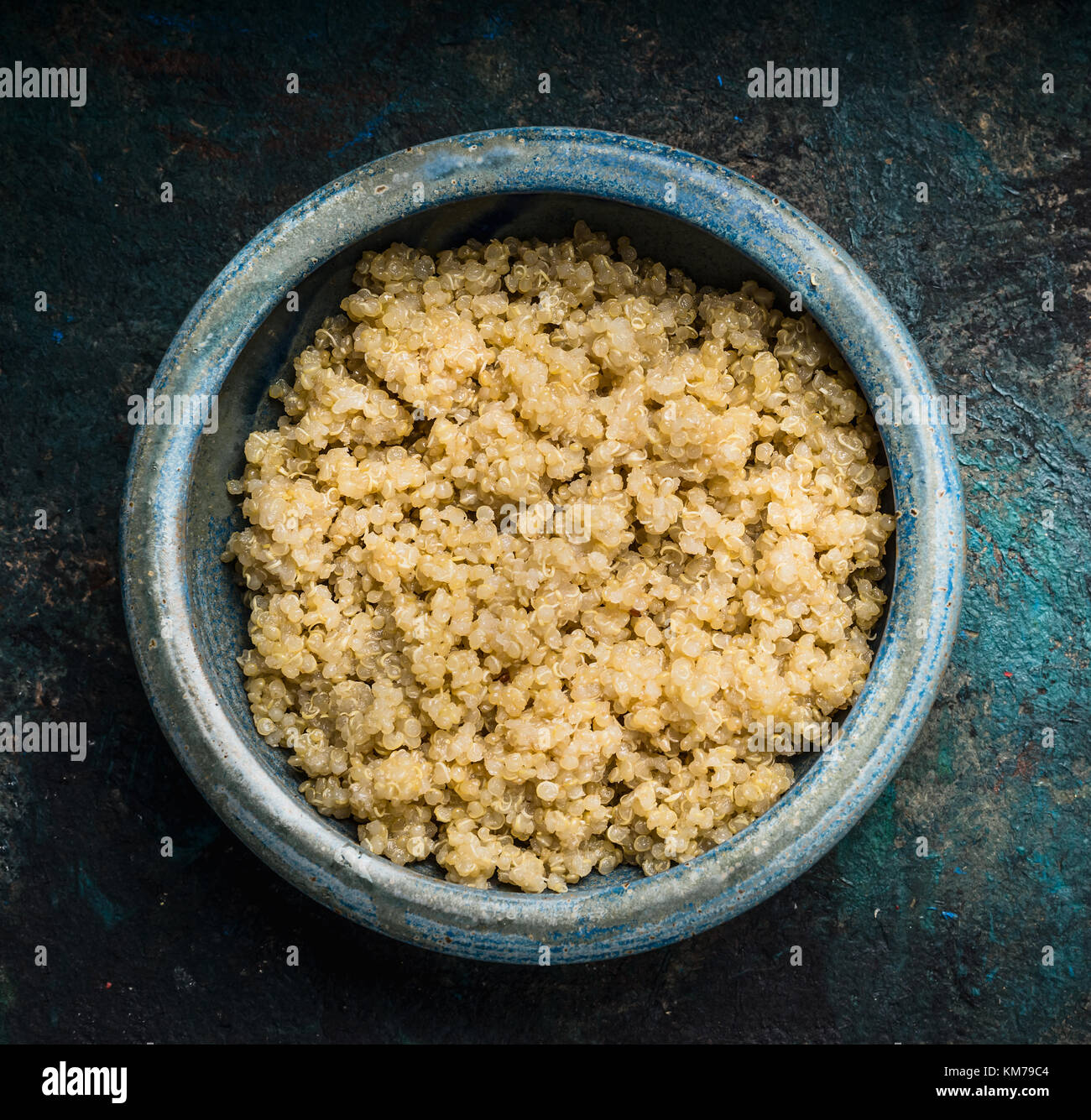Close up of cooked quinoa seeds in rustic bowl, top view. Superfood ...