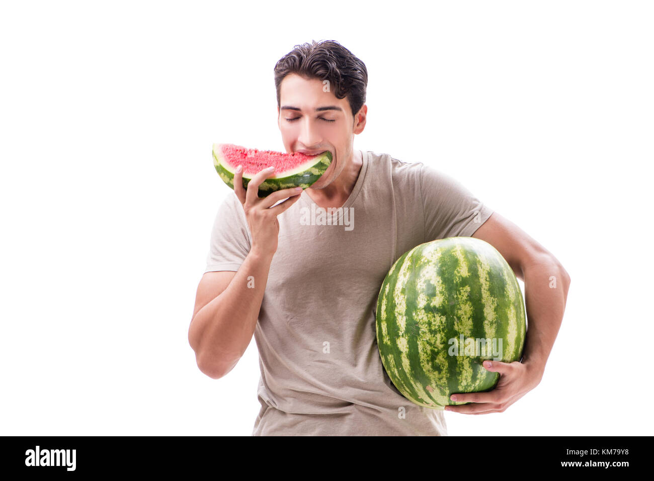 Young man with watermelon isolated on white Stock Photo - Alamy