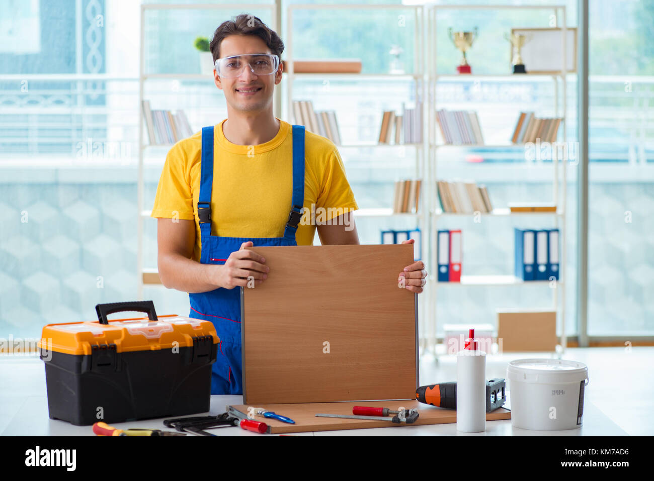 Furniture carpenter working in the workshop Stock Photo - Alamy