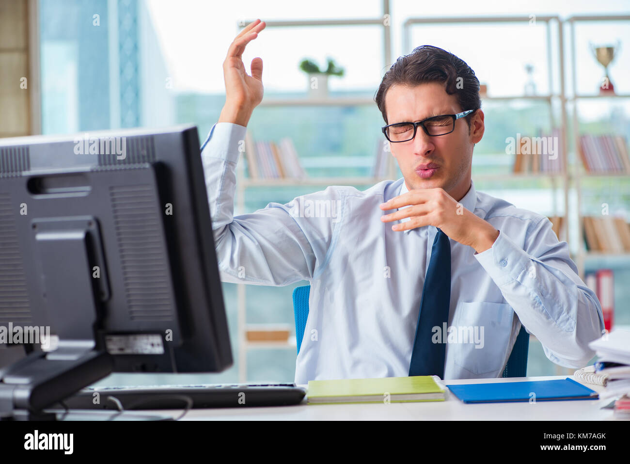 Businessman suffering from excessive armpit sweating Stock Photo - Alamy
