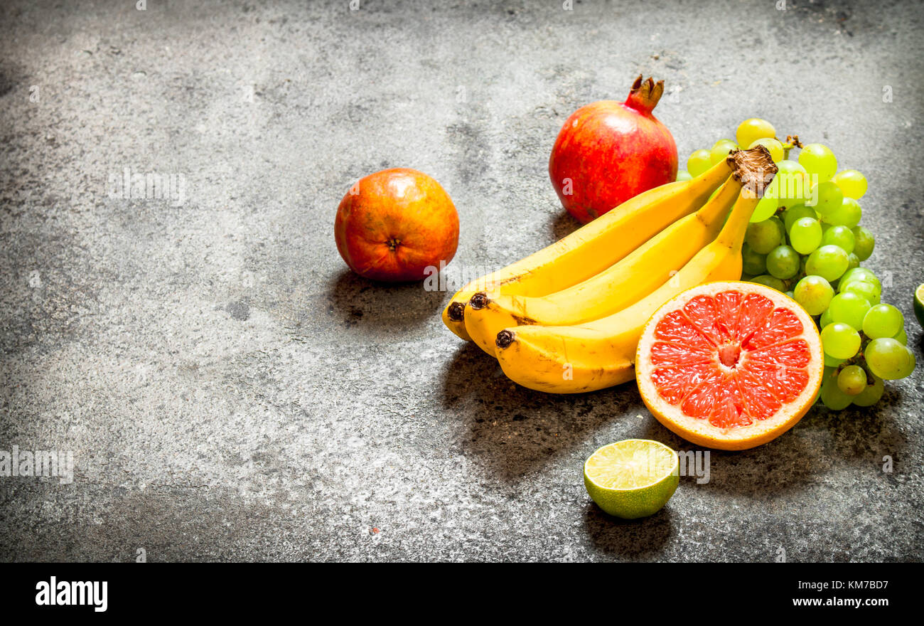 variety of fresh fruits. On rustic background Stock Photo - Alamy