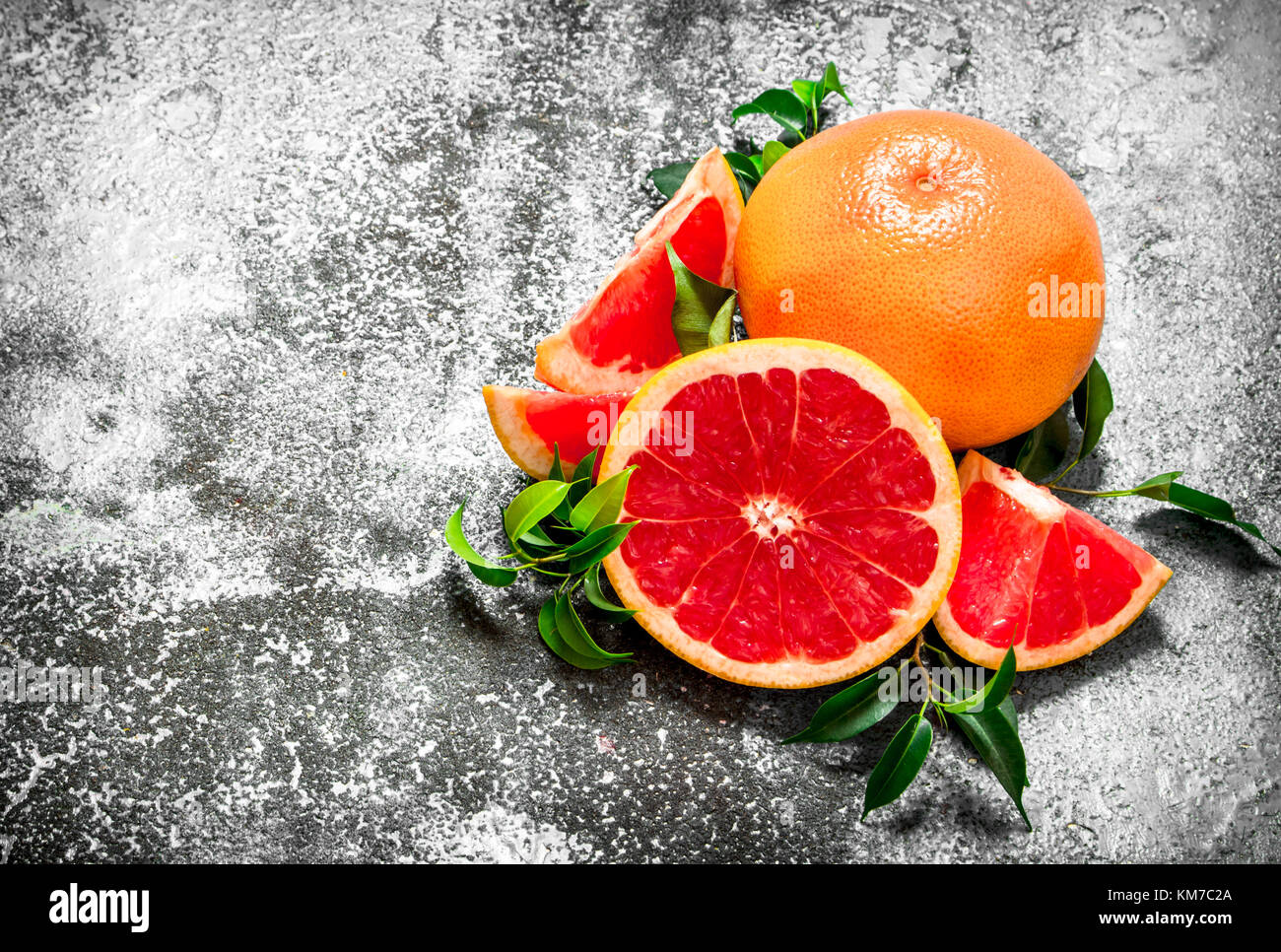 Fresh ripe grapefruits. On a rustic background Stock Photo - Alamy