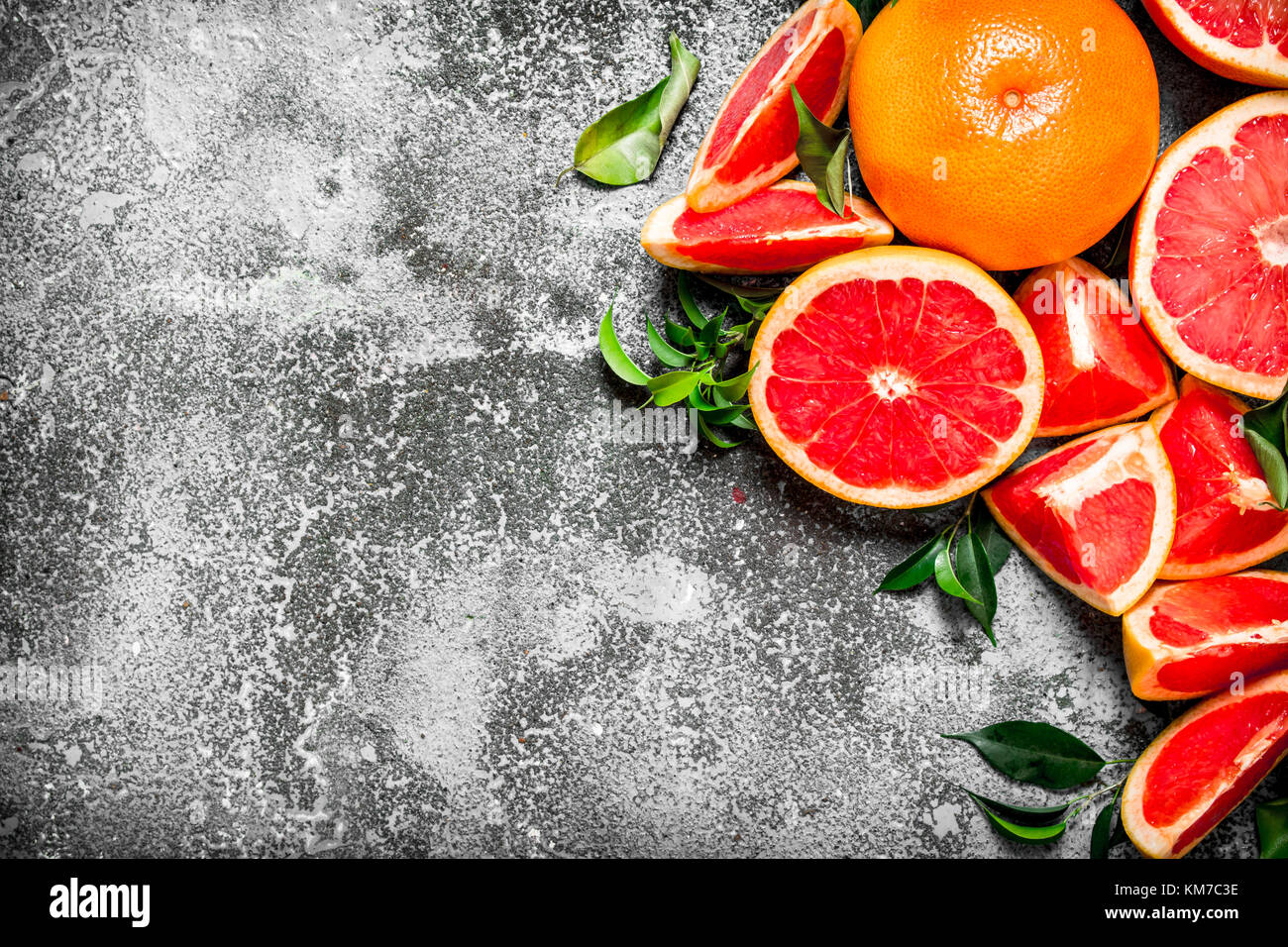 Fresh ripe grapefruits. On a rustic background Stock Photo - Alamy